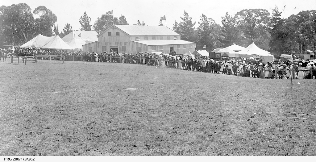 Marquees and spectators at an event on the showgrounds at Mount ...