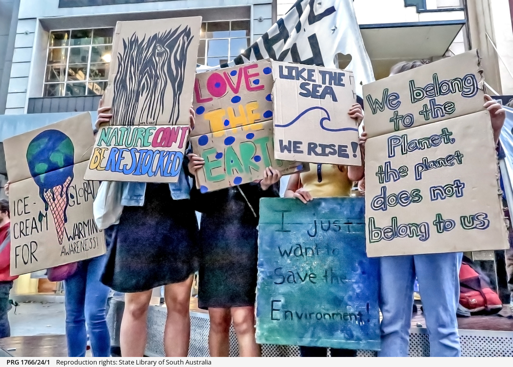 Climate protesters holding signs at the Adelaide Climate Action Now ...