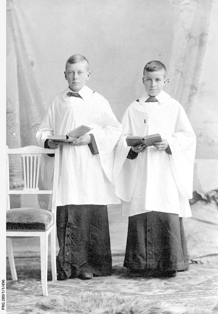 Two choirboys holding hymn books identified as Reg and Eric Searcy ...